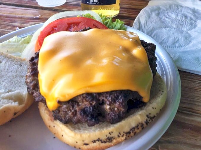This isn't just a burger – it's a monument to beef. The melted cheese cascades down the sides like a yellow waterfall of deliciousness.