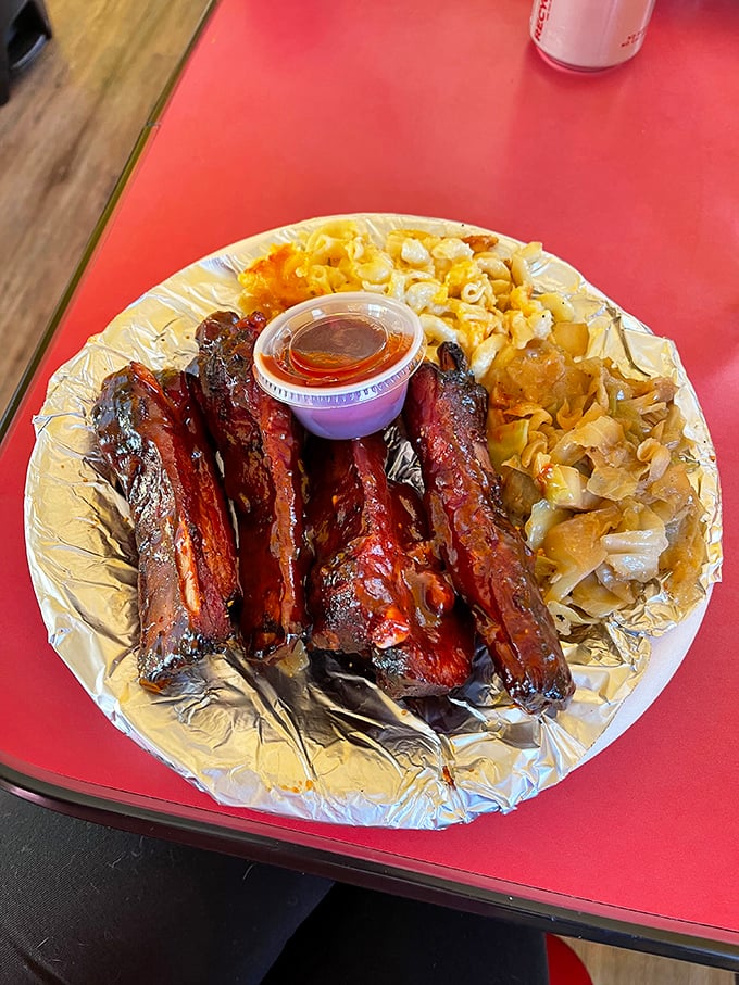 Ribs with that perfect mahogany sheen, where the smoke ring isn't just visible—it's practically announcing itself with a bullhorn.