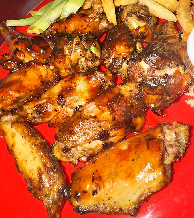 These wings didn't just get smoked—they got transformed. Burnished to mahogany perfection, they make ordinary buffalo wings seem like they're not even trying.