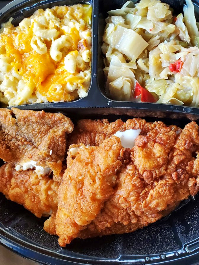 Crispy fried chicken flanked by mac and cheese and cabbage – a Southern trifecta that makes fancy restaurant plates seem unnecessarily complicated.