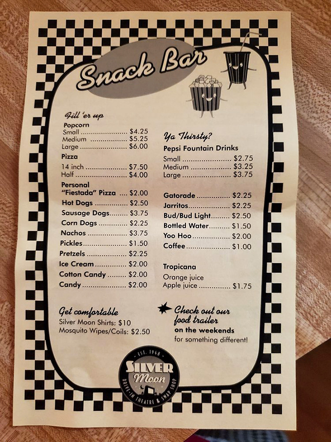 Classic drive-in menu that hasn't surrendered to inflation—where a Yoo Hoo and popcorn still constitute perfect movie fuel.
