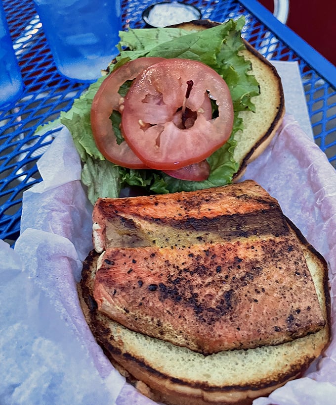 The Sockeye Salmon Sandwich proves Blue Moon isn't just about burgers and curds – this perfectly grilled fish with fresh toppings offers a lighter option without sacrificing flavor.
