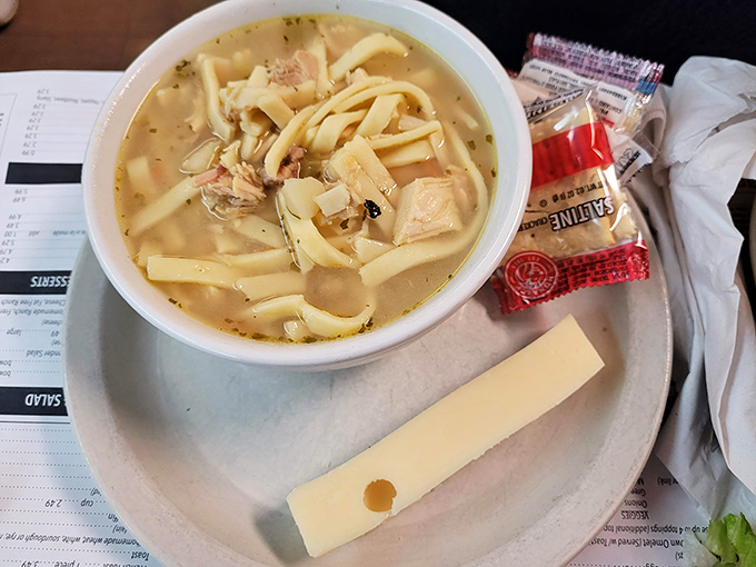 Homemade chicken noodle soup with noodles thick enough to stand on their own—the kind grandmothers everywhere would approve with a knowing nod.