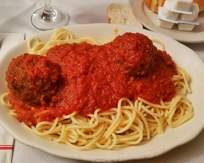 Spaghetti and meatballs—the Sinatra of Italian-American cuisine. Those meatballs aren't just sitting on the pasta; they're holding court.