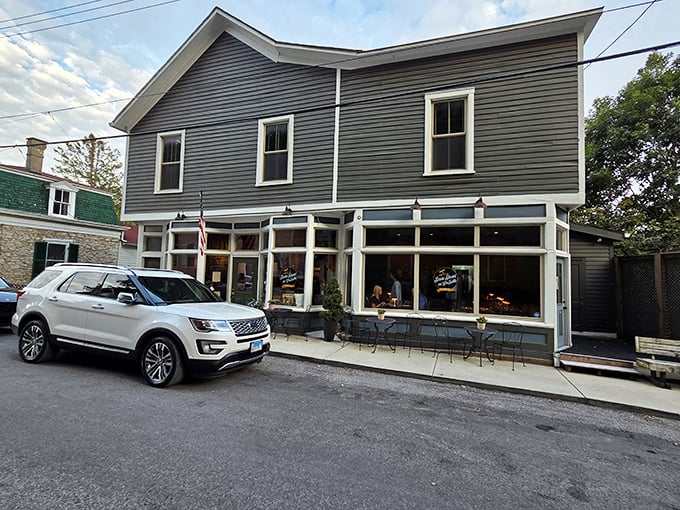 This storefront could teach modern architects a thing or two about creating spaces that welcome rather than overwhelm – simple, functional, and endlessly inviting.