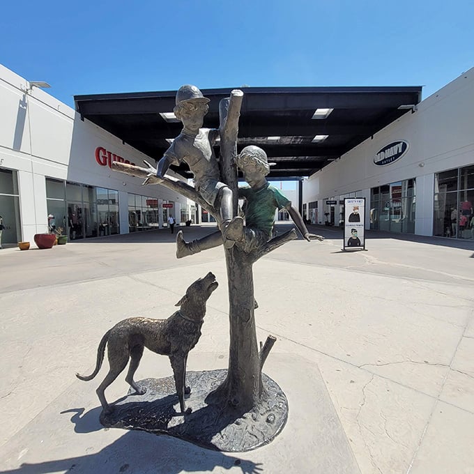 This whimsical sculpture of children climbing a tree with their faithful dog captures that fleeting moment before they discover online shopping.