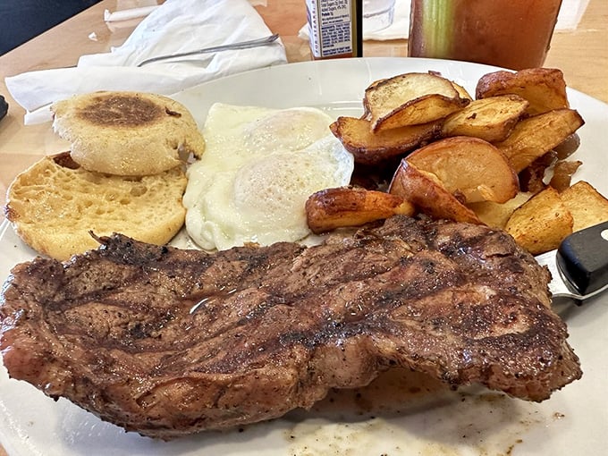 When breakfast goes bold – a perfectly seasoned steak alongside sunny-side-up eggs and potatoes that'll fuel your Florida adventures better than any energy drink.