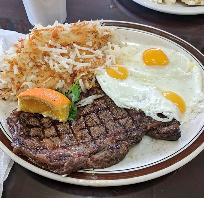 
The classic steak and eggs—a protein powerhouse that says, "Today might be tough, but your breakfast sure isn't." Those hash browns deserve their own fan club. 