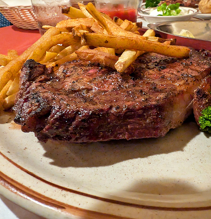 This isn't just a steak—it's a masterclass in simplicity. Oak-grilled perfection with a side of golden fries that demand to be savored.