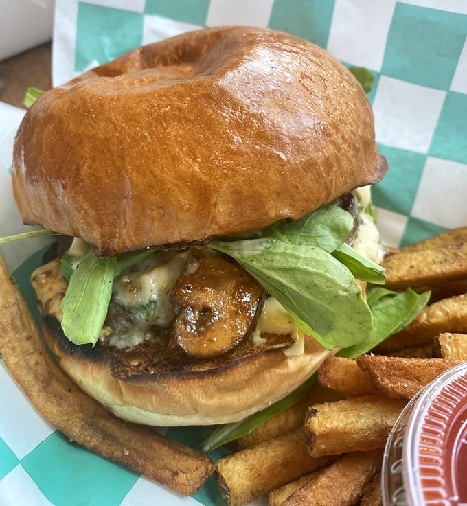 The Steakhouse Burger—where mushrooms and blue cheese have found their forever home atop a perfectly seared patty. Arugula adds peppery sophistication.