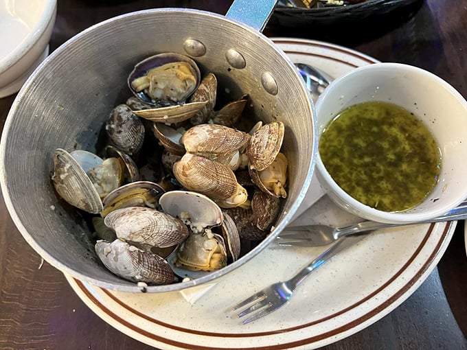 These steamed clams, swimming in garlicky broth, are like little treasures from the deep waiting to be discovered.