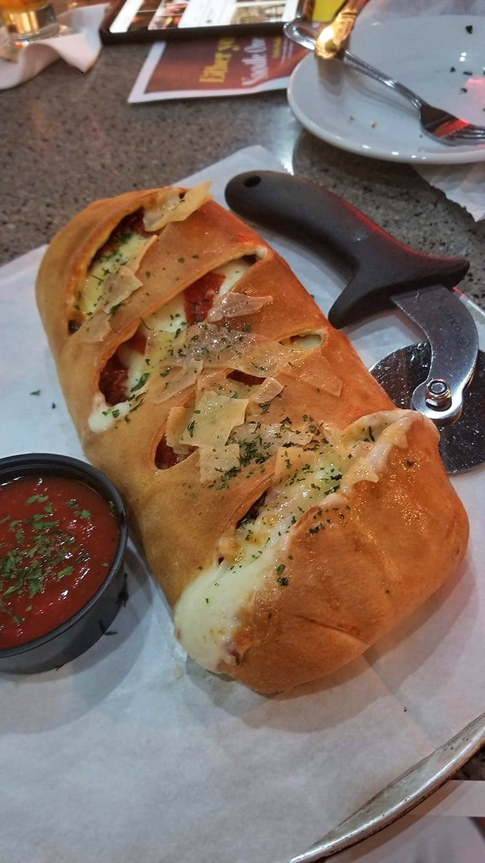 A stromboli that emerges from the brick oven looking like it should have its own theme music. Cheese pull for days and marinara that demands to be dipped into.