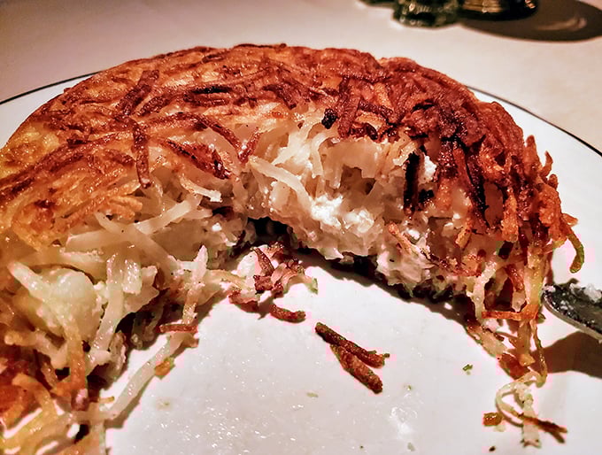 Cut into these stuffed hash browns and witness the miracle of potato engineering—crispy exterior giving way to a creamy center that defies physics.