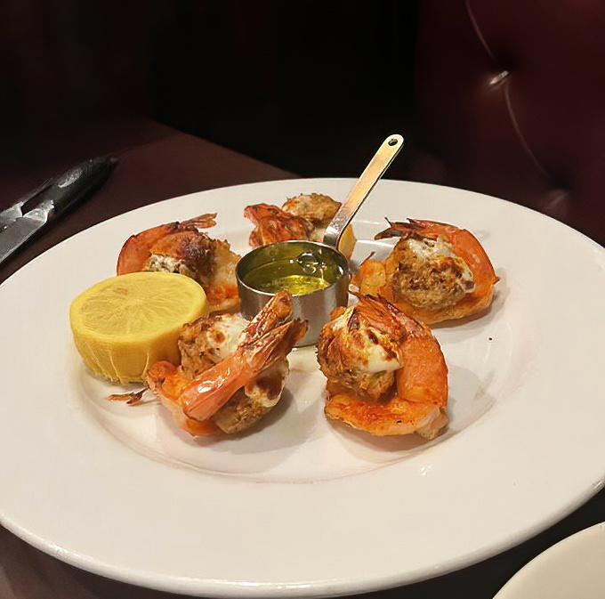 These stuffed shrimp aren't playing supporting roles—they're scene-stealers, dressed in their finest garlic butter and ready for their close-up.
