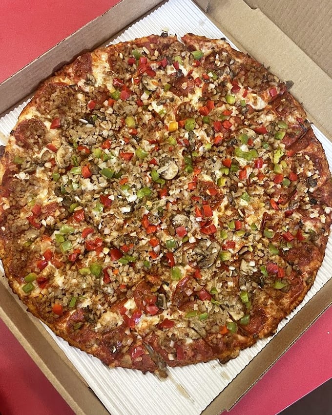 The Supreme Pizza – where every colorful topping fights for your attention but somehow works together like the world's most delicious committee meeting.