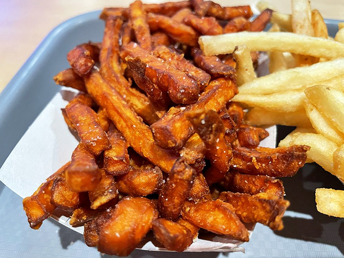 Sweet potato fries that somehow avoid the sogginess plague. These crispy orange wonders might just upstage their potato cousins.