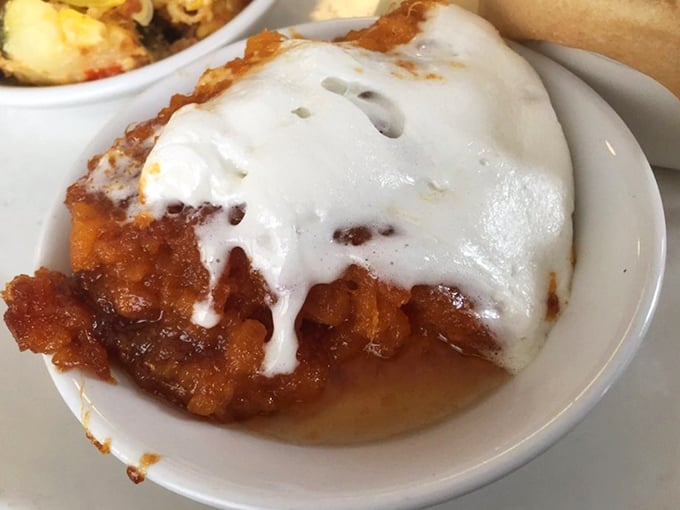 Sweet potato soufflé topped with melting marshmallow—the dish that makes vegetables taste like dessert and dessert feel like a vitamin.