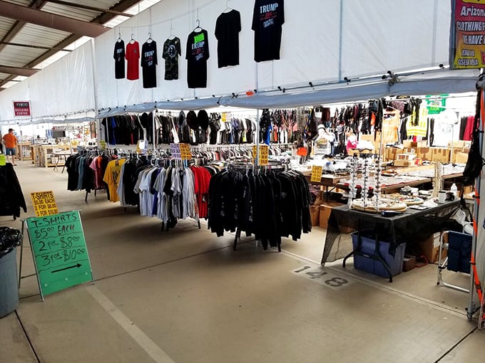T-shirt alley – where desert humor, political opinions, and vacation memories hang side by side in a fabric-based United Nations of personal expression.