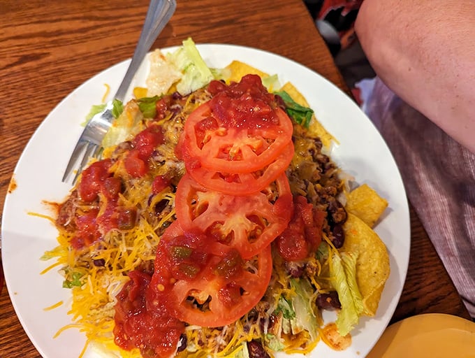 This taco salad isn't messing around. Fresh tomatoes standing at attention atop a mountain of Tex-Mex goodness—a fiesta that somehow feels right at home in Amish country.