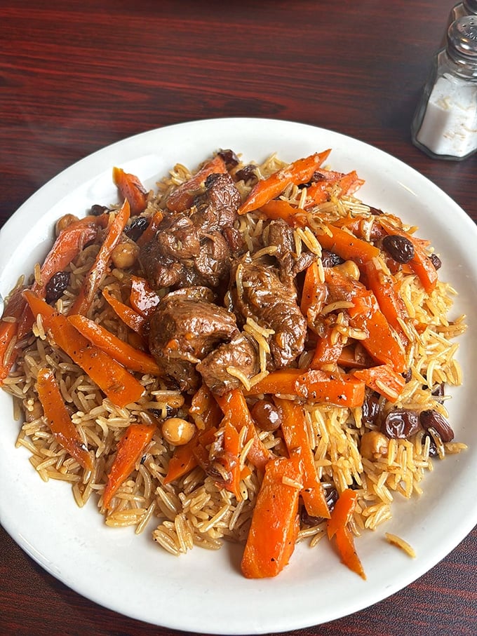The Tajik pilaf isn't just rice and meat—it's a colorful celebration where carrots and tender lamb throw the party of the year.
