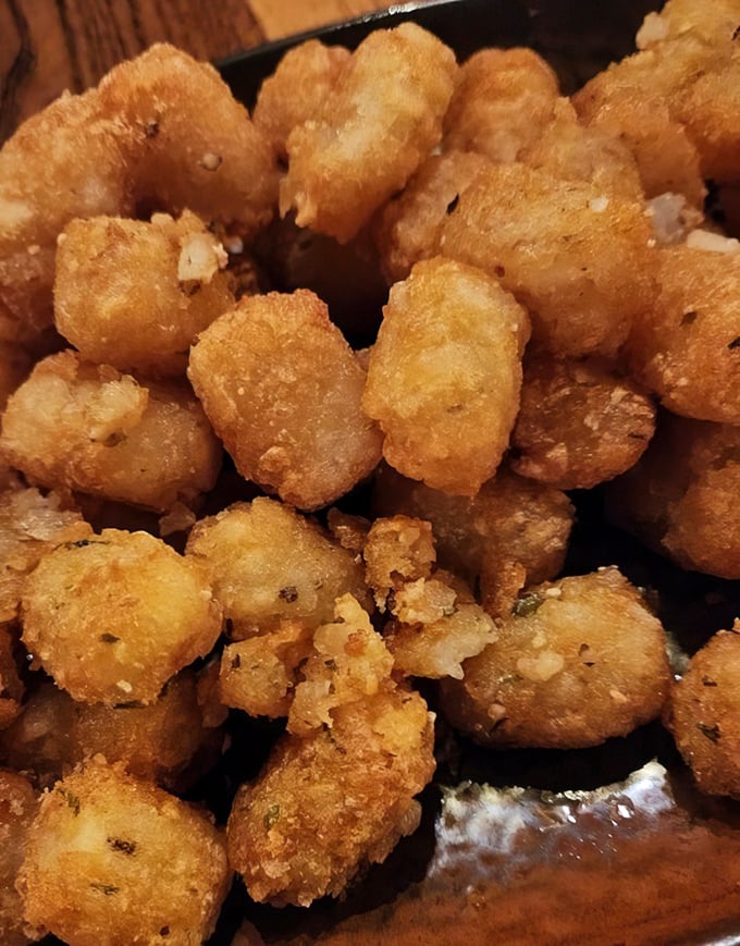 Tater tots dressed up for a night out – because sometimes potato perfection needs cheese and all its friends.