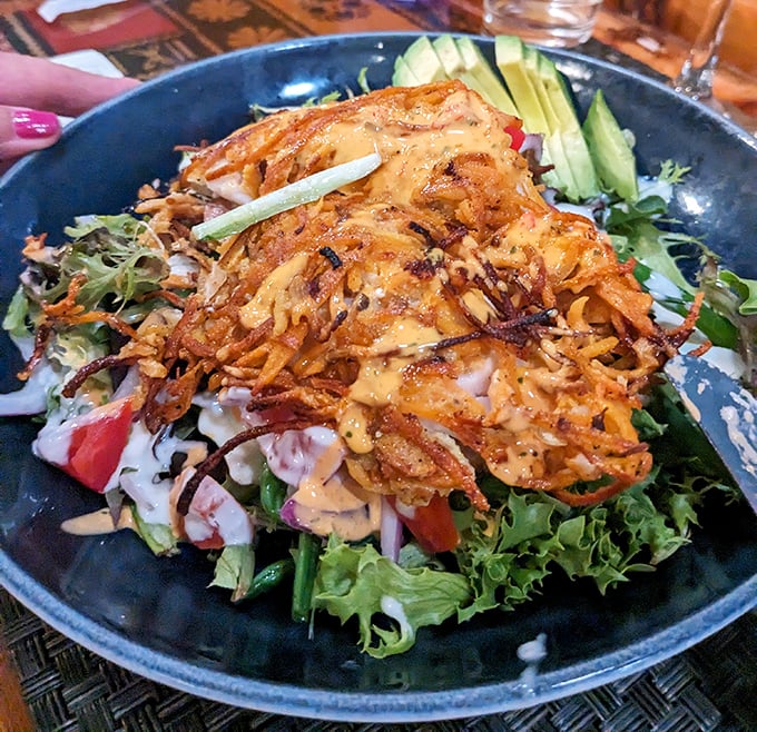 This salad topped with crispy sweet potato strands isn't just eating your vegetables—it's celebrating them with a crunchy crown.