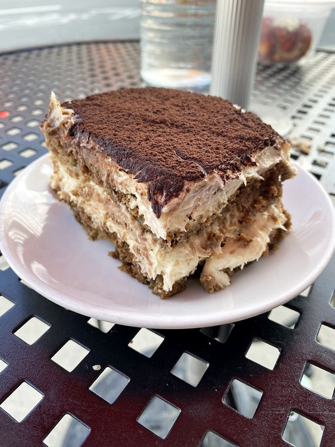 Tiramisu that doesn't skimp on the cocoa dusting – each layer promising the perfect balance of coffee, mascarpone, and "just one more bite."