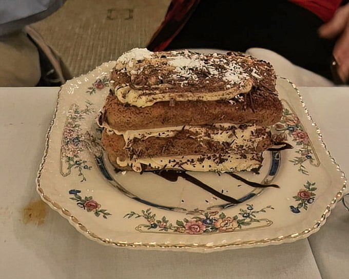 Tiramisu that looks like it graduated with honors—layers of espresso-soaked ladyfingers and mascarpone creating the Harvard of Italian desserts.
