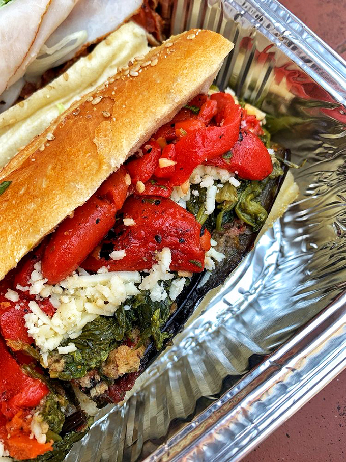 Roasted red peppers, greens, and what appears to be broccoli rabe—proof that Italians knew plant-based eating was delicious long before it was trendy.