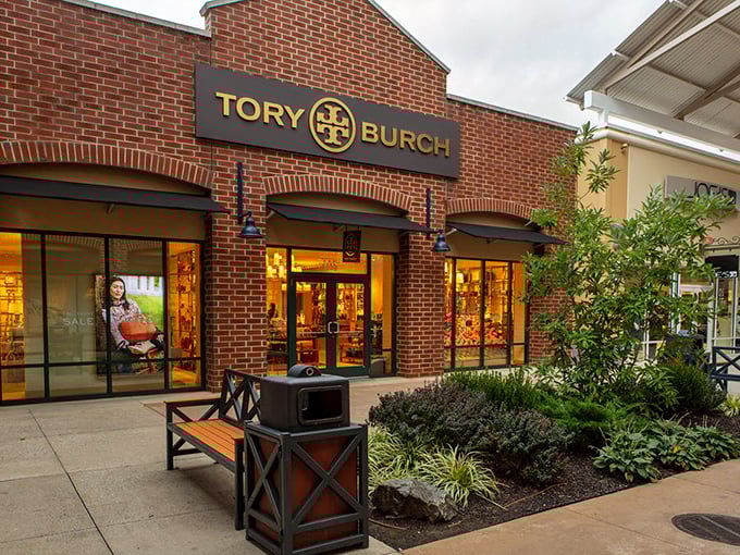 Tory Burch's meticulously landscaped storefront feels like the front yard of fashion royalty. That bench invites you to rest, but those window displays won't let you sit long. 