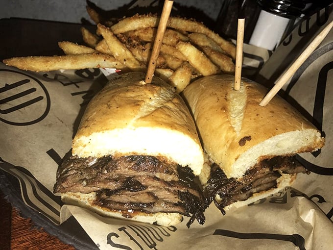 The tri-tip sandwich—California's contribution to barbecue greatness—sliced thin, piled high, and ready to ruin all other sandwiches for you forever.