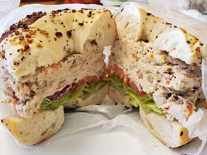 Behold the humble tuna sandwich—elevated to art form with fresh veggies and that perfect bagel foundation.
