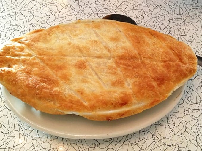 This turkey pot pie isn't just dinner—it's edible architecture! That golden crust is the roof over a party your taste buds are invited to.