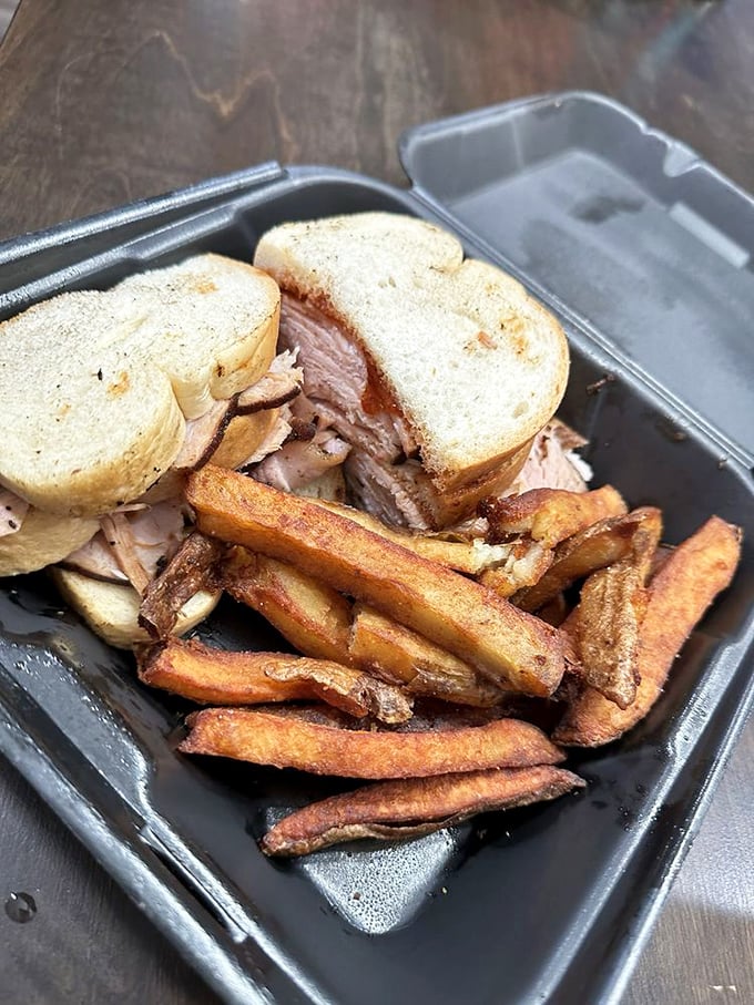 The turkey sandwich – proof that poultry can hold its own in a beef-dominated world when treated with proper smoky respect.
