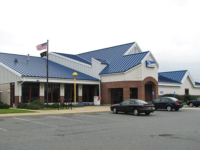 Neither snow nor rain nor retirement planning will keep you from this architecturally distinctive post office. Blue roof, brick base, and all-American service.