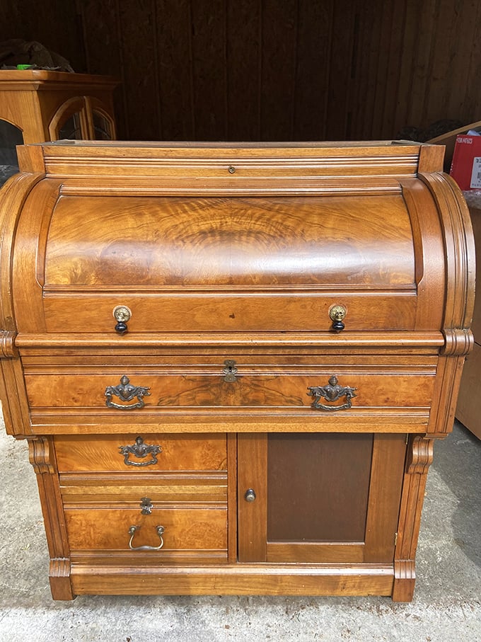 This roll-top desk has probably hidden more secrets than a small-town banker - each drawer a repository for someone's important papers.