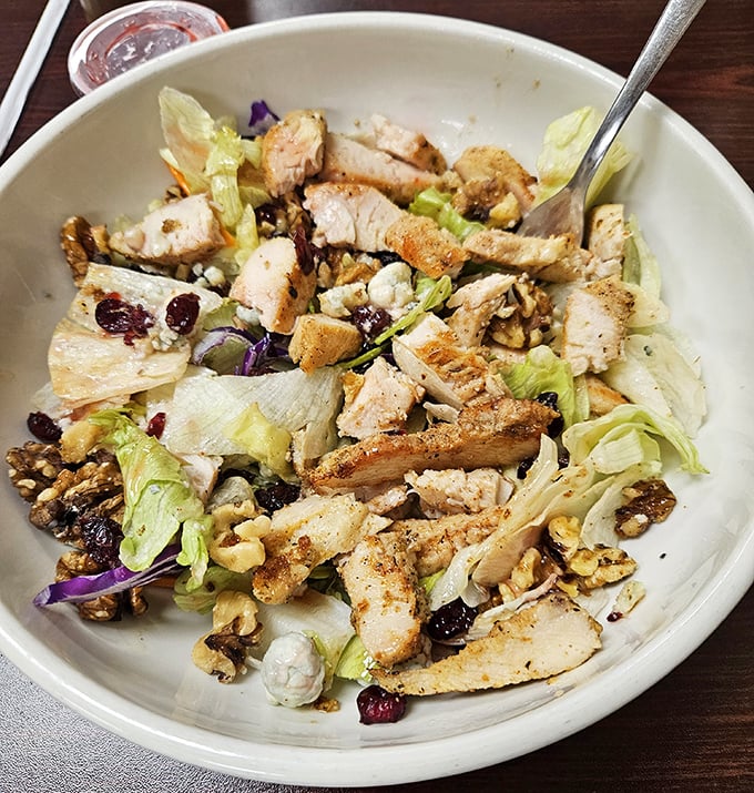 Even salads get the hearty treatment here—this chicken Waldorf combines crisp lettuce, nuts, and dried fruit in a refreshing counterpoint to the diner classics.