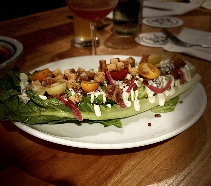 This isn't your grandmother's wedge salad – unless your grandmother was a culinary genius who understood the perfect balance of crisp lettuce, vibrant tomatoes and crunchy toppings.