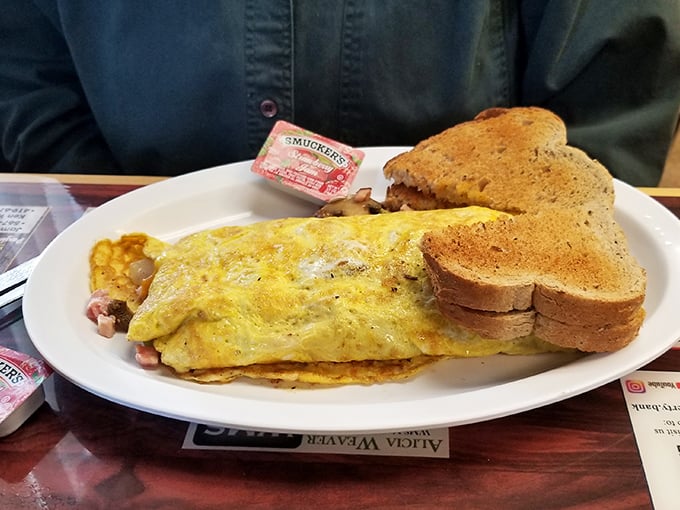 An omelet that's seen more fillings than a dentist's office. Paired with buttery toast, this Western creation is the breakfast equivalent of hitting the jackpot.