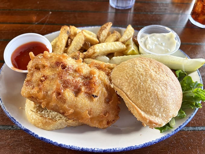 The sandwich that launched a thousand road trips. Crispy whitefish on a pillowy bun – proof that simplicity, when done right, is culinary genius.