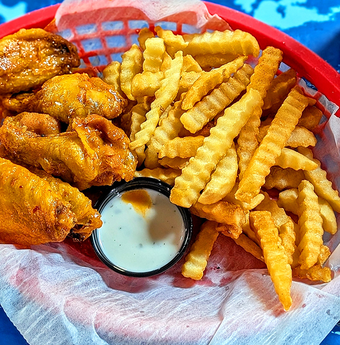 Golden-fried wings and crinkle-cut fries—the perfect supporting cast to an oyster feast. Sometimes the sidekicks deserve their own standing ovation.