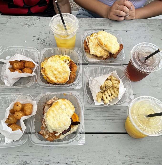 A feast fit for royalty served in humble takeout containers. The juxtaposition of gourmet flavors in casual packaging is pure Norfolk genius.