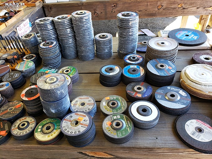 A metalworker's dream display of grinding discs stacked like industrial pancakes—tools with stories waiting for new chapters.
