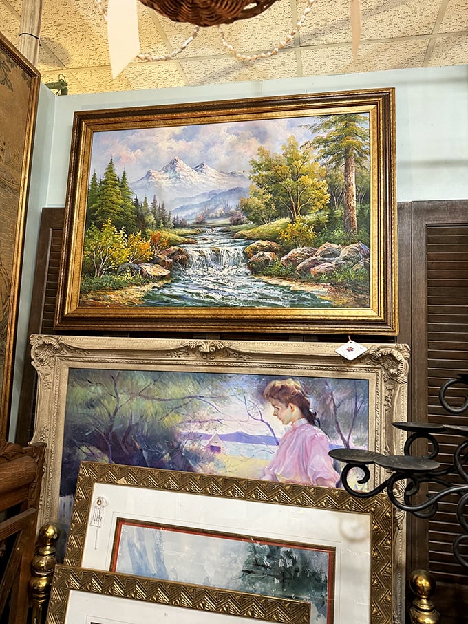 Wall-to-wall nostalgia! These framed landscapes and portraits aren't just decorative—they're windows into bygone artistic sensibilities.