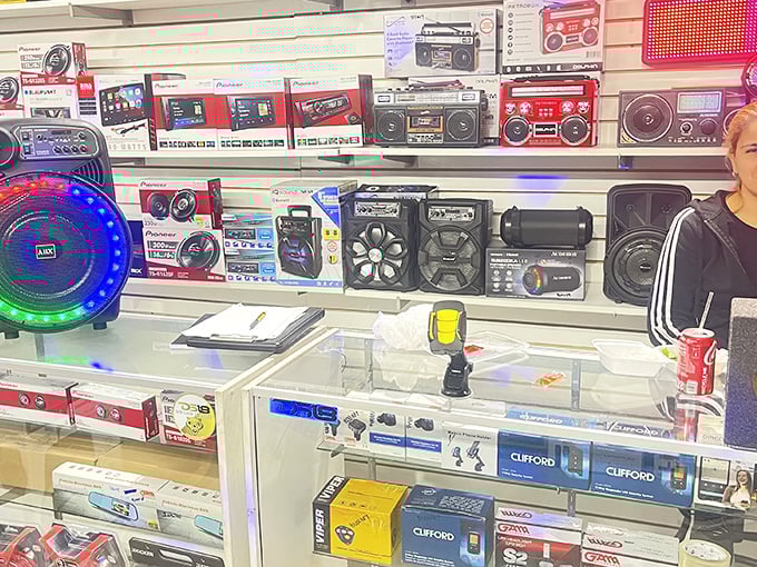 A wall of sound systems that would make any 80s kid nostalgic—boomboxes and speakers ready to blast your life's soundtrack.