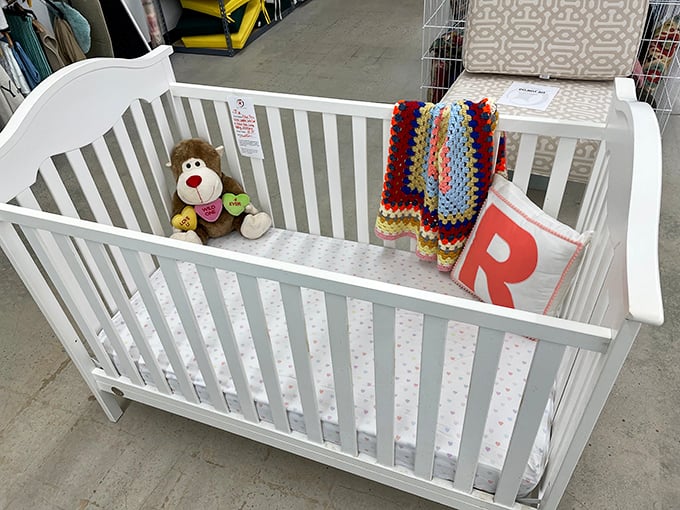 A pristine white crib complete with teddy bear roommate. Someone's nursery is about to get an affordable upgrade with vintage charm.