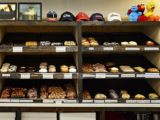 The display case—a museum of edible art where each shelf tells a different sweet story. I'd like tickets to all the exhibits, please.