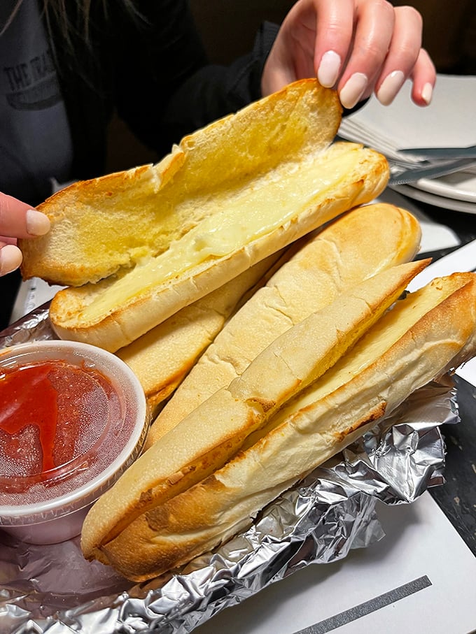 Cheese sticks that actually deliver on their gooey promise—stretchy, buttery, and ready to be dunked in that little cup of marinara like Olympic divers.