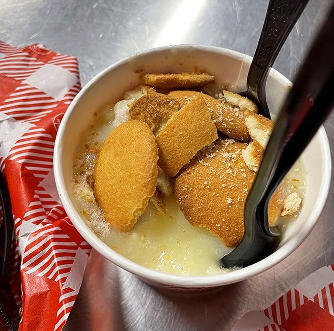 Banana pudding isn't dessert; it's sweet, creamy therapy after the cayenne storm—vanilla wafers floating like life rafts in a sea of comfort.