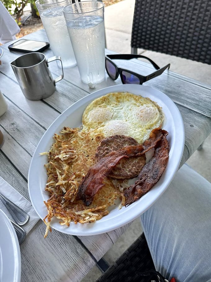 Eggs, hash browns, and bacon—the holy breakfast triumvirate executed with the precision of a culinary symphony. Simple yet profound.